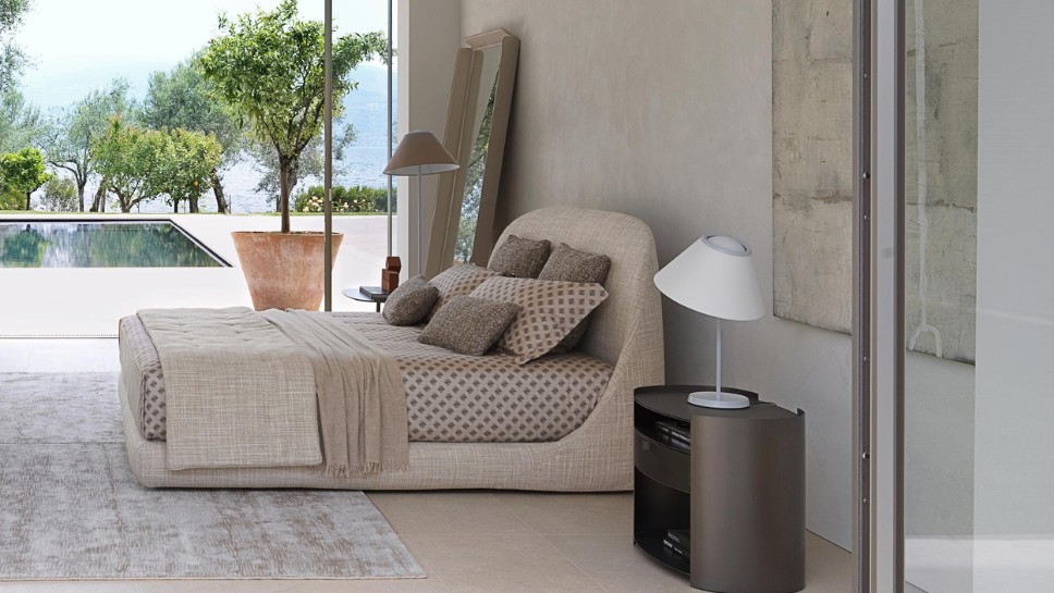 Taormina bed and Lotus bedisde table by Flou